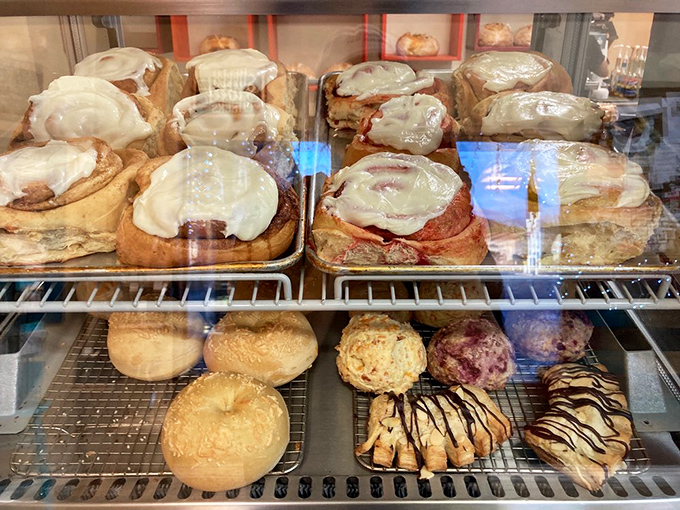 The display case at Muddy Bees isn't just refrigerated—it's a museum of edible art where every shelf deserves its own admission ticket.