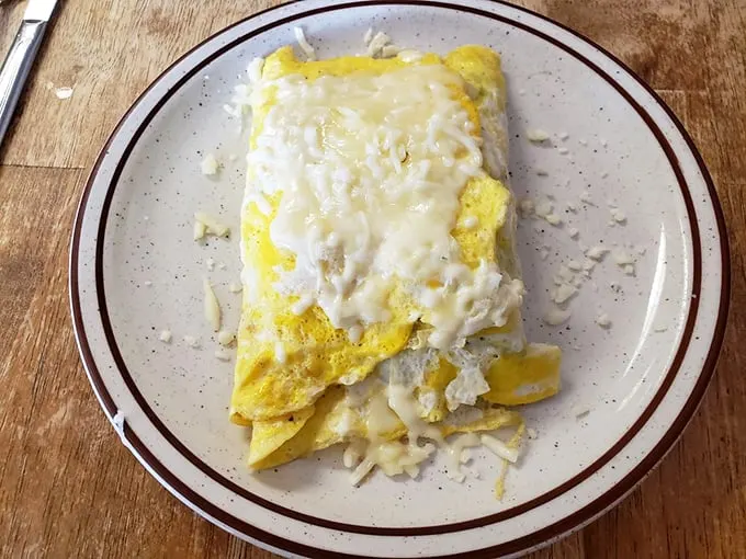 The Philly omelet brings a taste of Pennsylvania to West Virginia—cheese melting into every crevice like it's found its forever home.