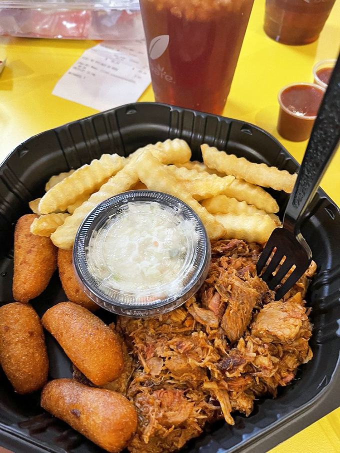 Pulled pork, hush puppies, and crinkle-cut fries – the kind of meal that makes you wonder why you ever eat anything else.