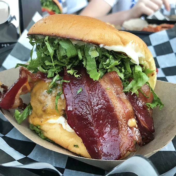 When bacon drapes over a burger like this, it's not an ingredient—it's a statement of delicious intent.