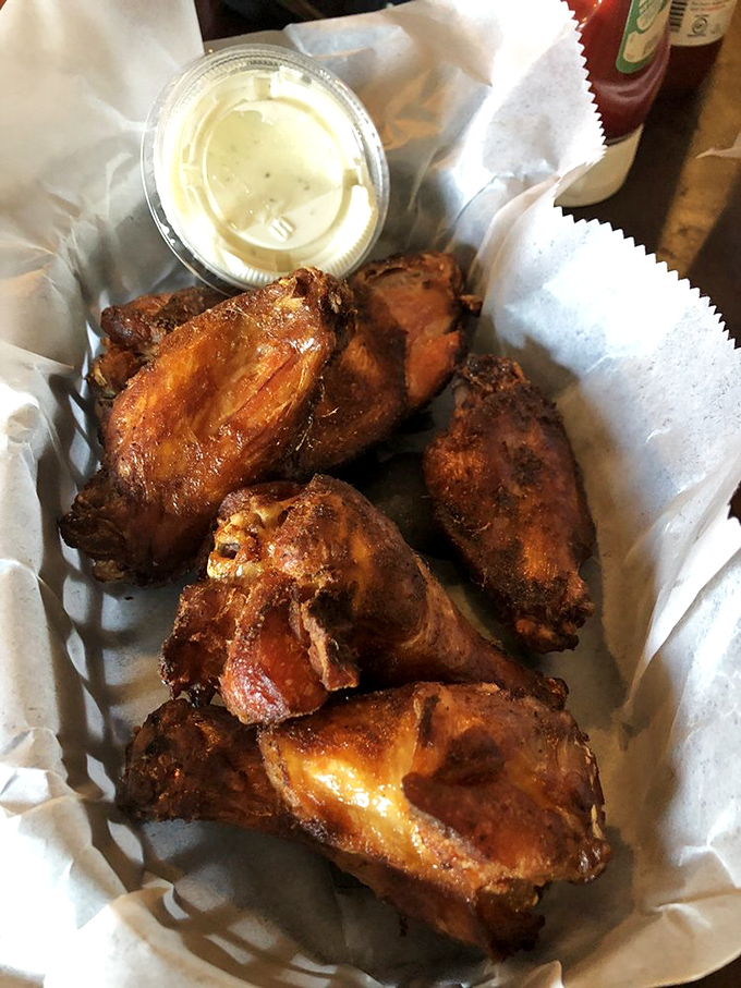 Wings so perfectly smoked and seasoned they deserve their own fan club. That dipping sauce? The VIP section of flavor town.