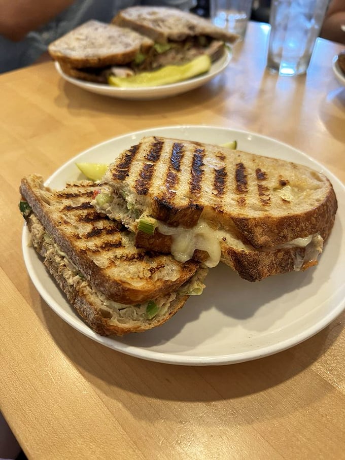 Grilled perfection that makes tuna melts an art form. That pickle isn't just garnish—it's the perfect palate cleanser.