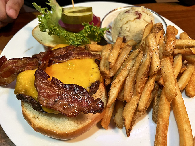 This isn't just a burger—it's a masterpiece of melted cheese, crispy bacon, and perfectly charred beef that makes you wonder why you ever ordered anything else.