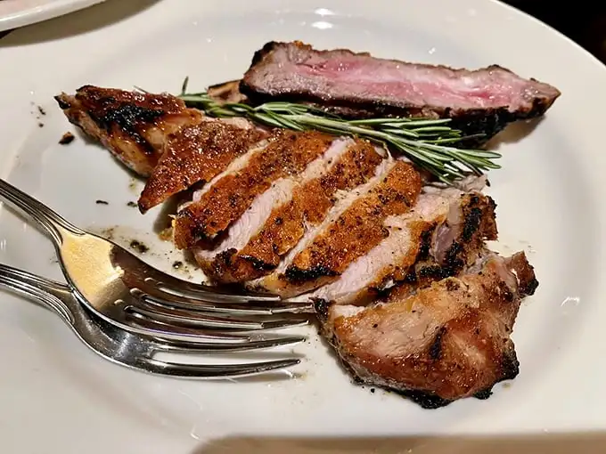 A veal chop cooked with more care than most people give their firstborn. Pink in the middle, charred on the outside – perfection.