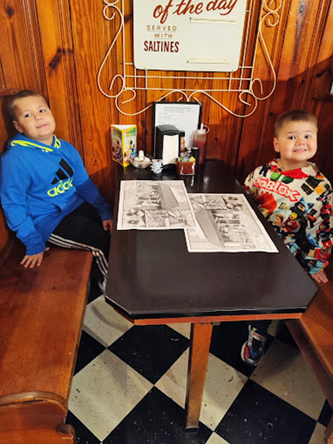 Teaching the next generation the sacred ritual of the chocolate shop visit – these kids already know what truly matters in life.