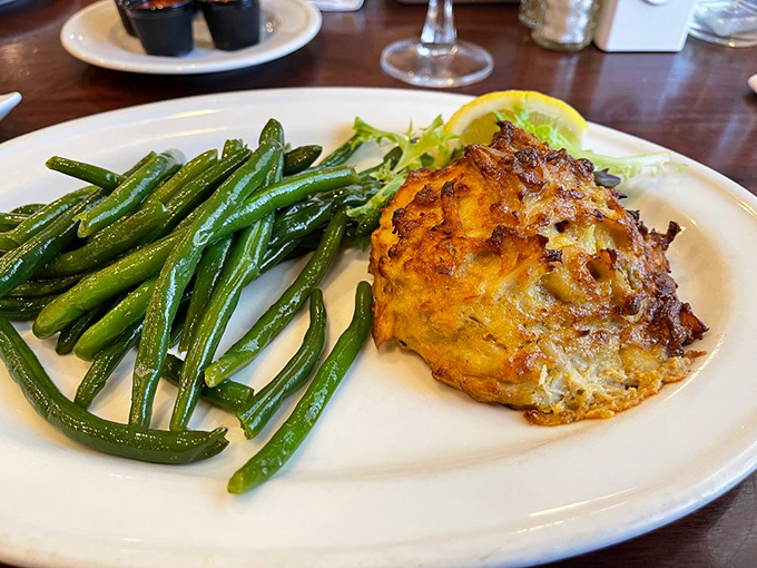 The famed Maryland crab cake with green beans – proof that sometimes the simplest presentation lets the star ingredient shine brightest.