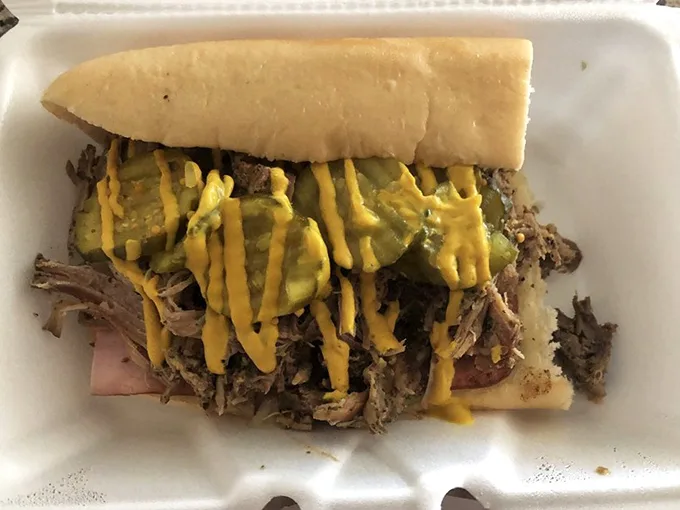 This isn't just a sandwich—it's a Cubano masterpiece where pulled pork, pickles, and mustard perform a perfectly choreographed flavor dance.