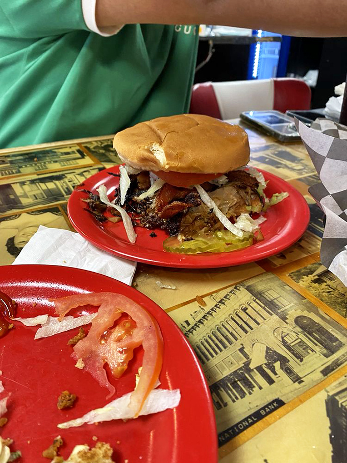 Double the meat, double the joy. This towering creation makes you wonder if your mouth will actually open wide enough—spoiler alert: it will.