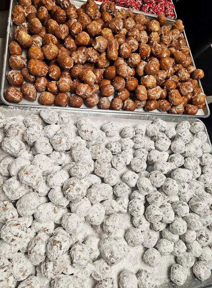 Donut holes: nature's perfect portion control system, until you've eaten forty of them. The glazed ones glisten with sugary promises.