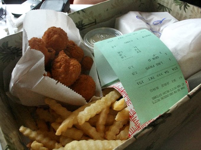 These aren't just chicken tenders and fries; they're childhood memories wrapped in a paper basket, complete with the receipt of happiness.