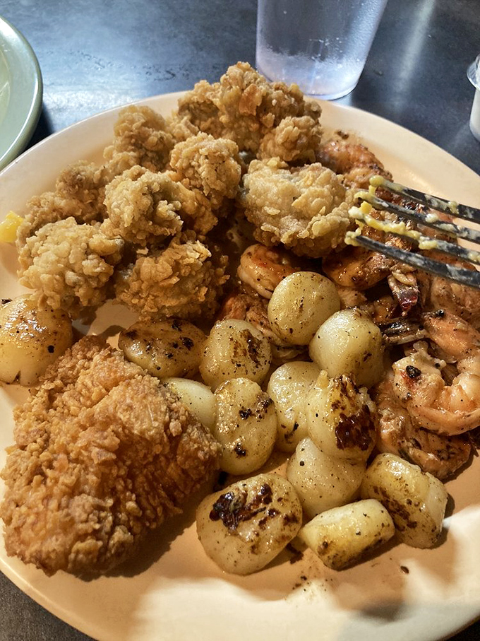 This seafood platter doesn't just feed your hunger—it tells stories of coastal waters through perfectly seasoned bites.
