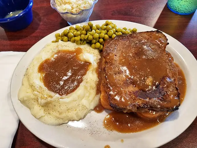 Meatloaf and mashed potatoes—comfort food that whispers, "Everything's going to be okay." That gravy could solve international conflicts if given the chance.
