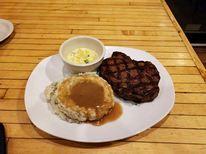 A ribeye, mashed potatoes with gravy, and corn—the holy trinity of Midwest comfort. This plate doesn't just feed you; it hugs you from the inside.