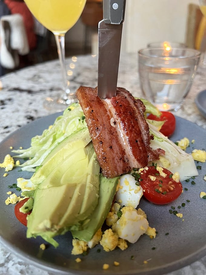 The wedge salad—where bacon doesn't just make a cameo appearance but takes center stage like the headliner it deserves to be.