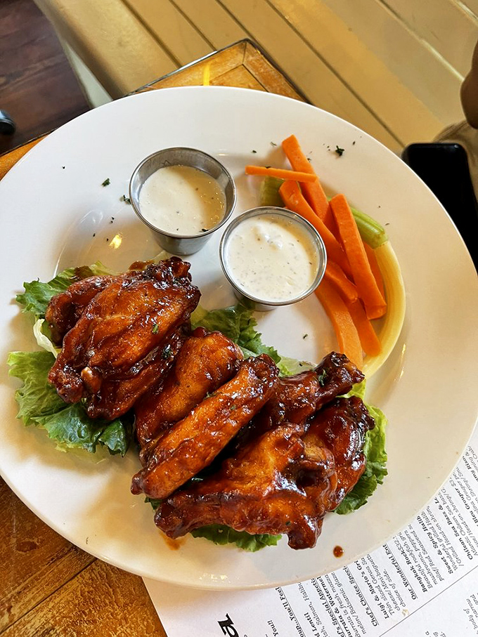 These wings aren't playing second fiddle to seafood—they're conducting their own sticky, sweet symphony alongside crisp vegetables and cooling dips.