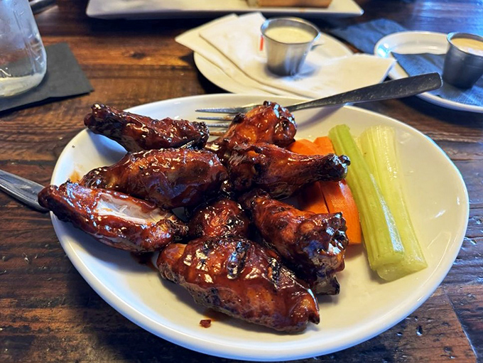 These wings aren't just glazed, they're wearing evening attire. Sticky, sweet, and ready to make your fingers the happiest they've been all week.