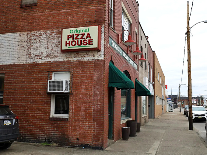 Original Pizza House – where that brick exterior has absorbed decades of pizza perfection like a culinary history book.