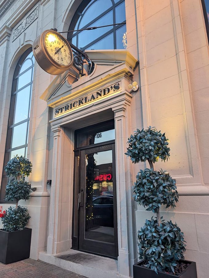 Strickland's elegant clock and entrance—because sometimes great steaks deserve the architectural equivalent of a tuxedo.