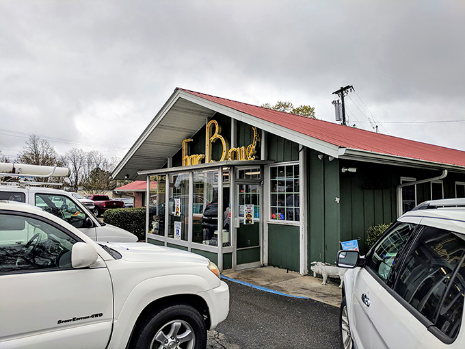 The red roof and vintage sign promise the kind of old-school barbecue experience that makes road trips worthwhile.