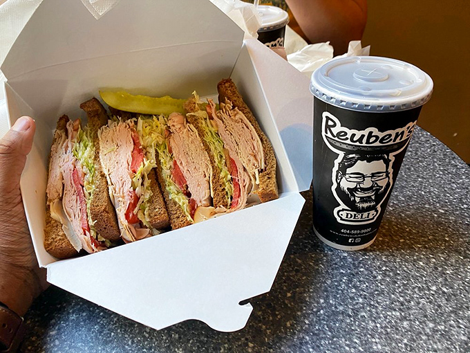 This isn't just lunch—it's edible architecture. Expertly layered meats, cheese, and vegetables create a tower of deliciousness that demands respect.