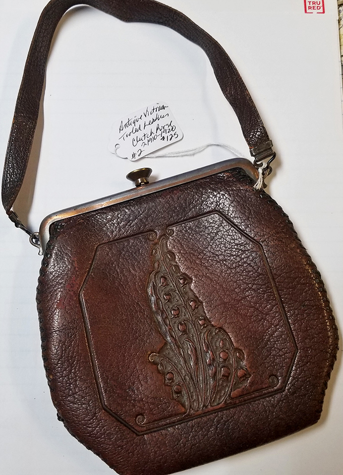This hand-tooled leather purse once dangled from someone's wrist at a county fair or Saturday night dance—craftsmanship that's outlasted fast fashion by decades.