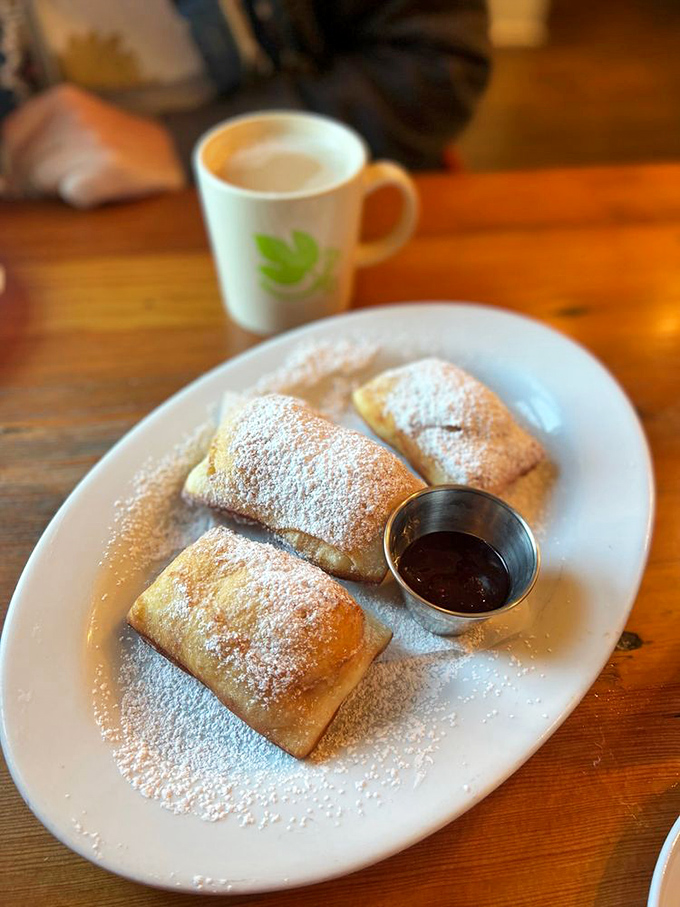 These beignets aren't just fried dough—they're pillowy portals to New Orleans, minus the humidity and plus the mountain views.