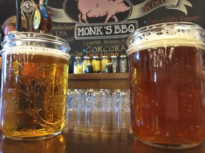 Mason jars aren't just for grandma's preserves anymore. These golden beauties offer the perfect counterbalance to smoky richness—civilized barbecue companionship in glass form.