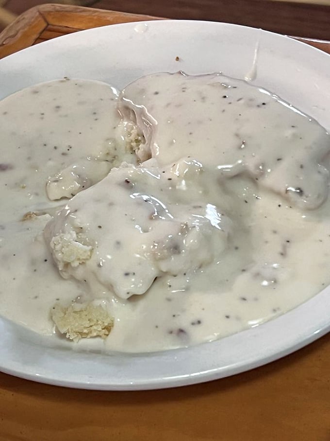 Biscuits swimming in creamy gravy—comfort food so soothing it should come with a warning: "May induce spontaneous napping."