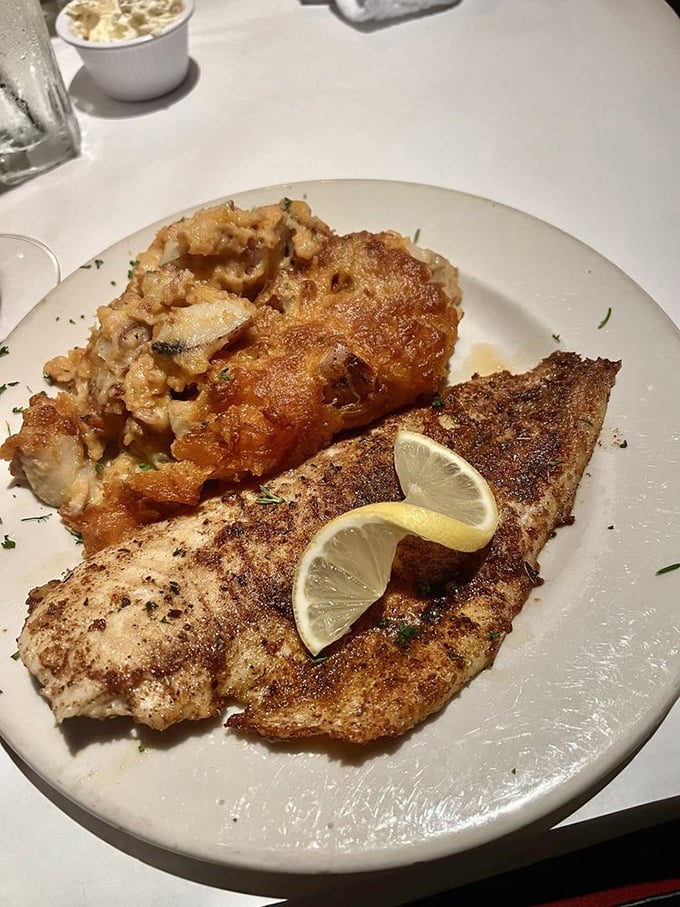Blackened redfish that's actually blackened, not burned—paired with a risotto that could make an Italian grandmother question her life choices.