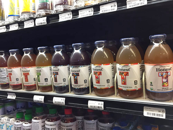 The beverage cooler—where decisions get tough and "I'll take one of each" becomes a legitimate consideration for the thirsty shopper.