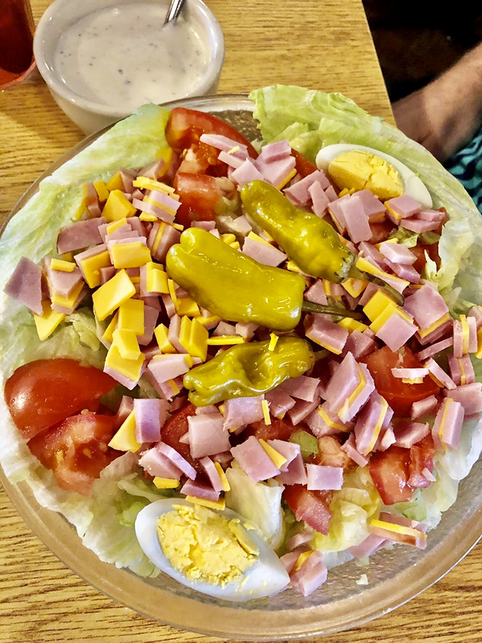 A chef salad that somehow makes vegetables exciting—like finding out your blind date is actually a supermodel.