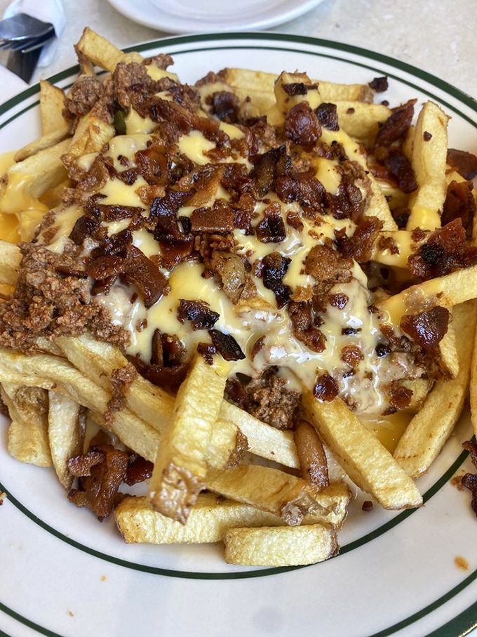 These chili cheese fries aren't just a side—they're a commitment. The kind of glorious mess that requires both a fork and absolutely no regrets.
