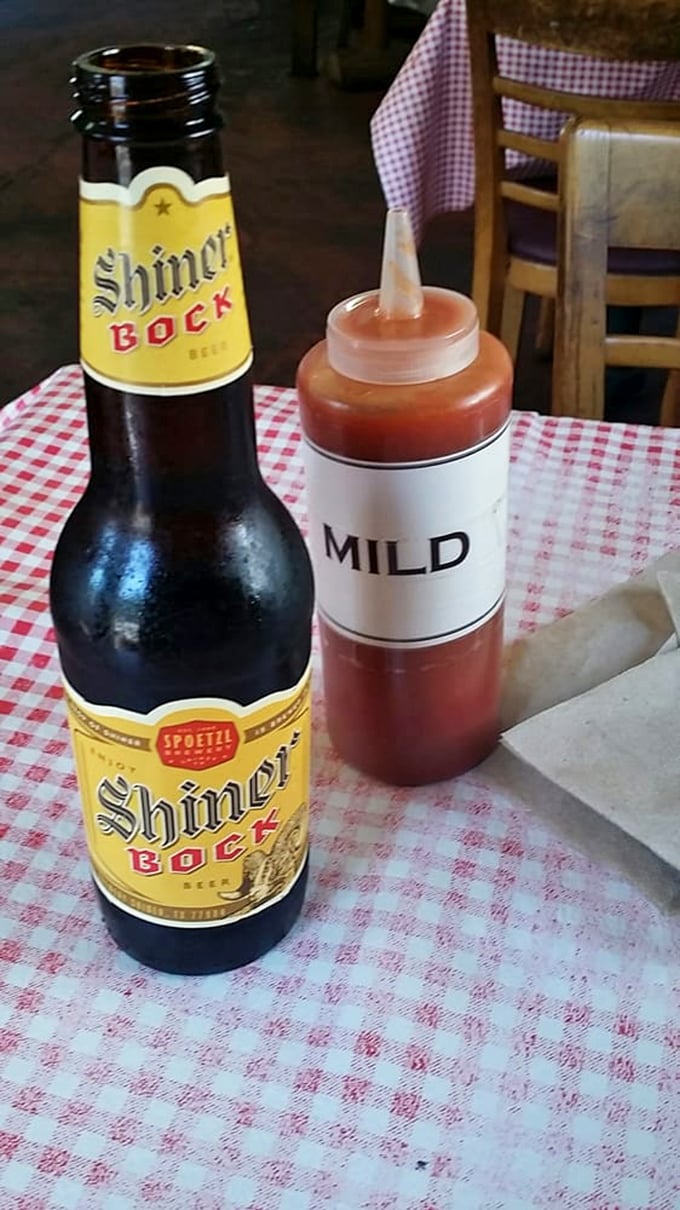 The universal language of barbecue: a cold Shiner Bock and squeeze bottle of sauce labeled "Mild"—though in New Hampshire, that might still raise a Yankee eyebrow.