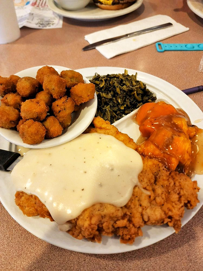 Southern fried chicken with cream gravy – proof that sometimes the best things in life require both napkins and a post-meal nap.