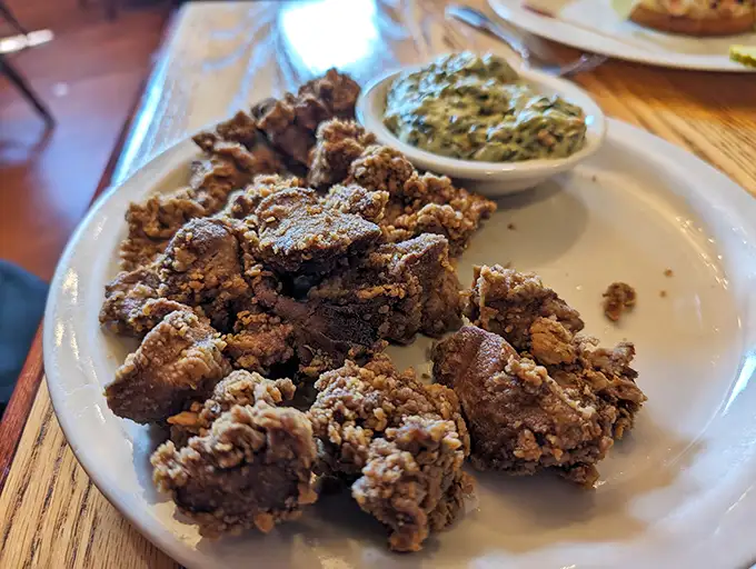 Chicken livers—the dish that separates casual diners from true Southern food aficionados—fried to crispy-outside, tender-inside perfection.