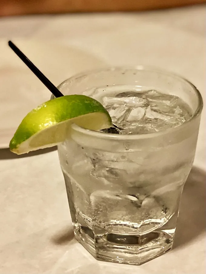 In the cathedral of meat, even the humble G&T knows its role—to refresh the palate between bites of bovine perfection.