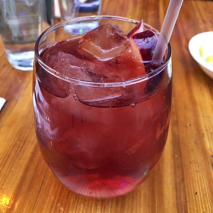This sangria isn't playing around—ruby red, ice-cold, and potent enough to make you forget you came for dinner in the first place.