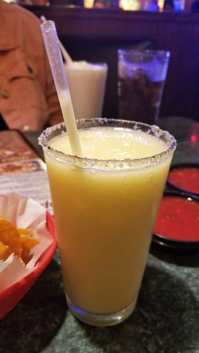 A frosty margarita, rimmed with salt and the promise of relaxation, is the perfect companion to Sabroso's flavor-packed menu.