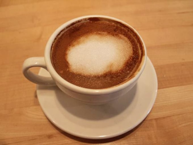 Coffee this good doesn't need fancy latte art—just perfect foam and a smooth finish that makes morning people out of night owls.