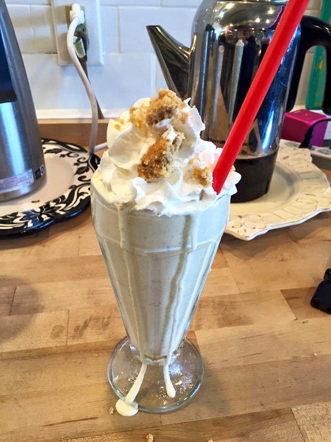 This isn't just a milkshake – it's a structural engineering marvel topped with enough whipped cream to make a cloud jealous.