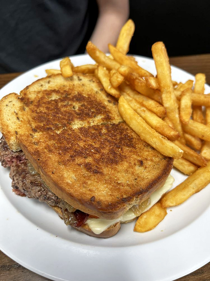 This patty melt isn't just a sandwich—it's an architectural achievement where beef, cheese, and grilled bread create the perfect bite.