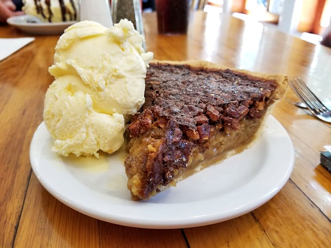 
Pecan pie that strikes the perfect balance between gooey and crunchy—the dessert equivalent of finding a twenty in your winter coat.