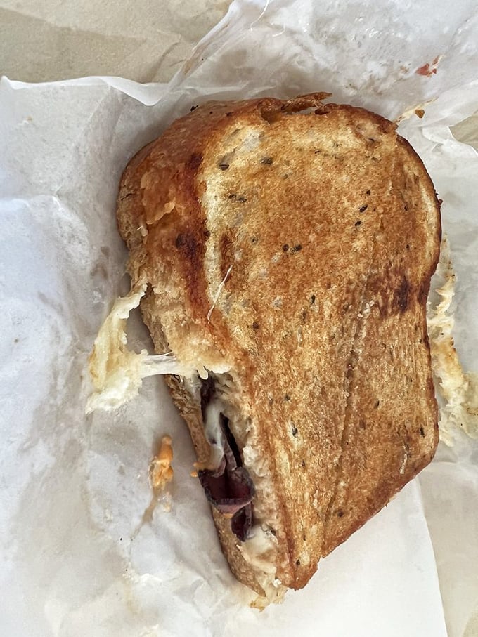 This toasted Reuben has that perfect cheese pull that food photographers dream about. The sandwich equivalent of a California sunset—dramatic and worth the wait.