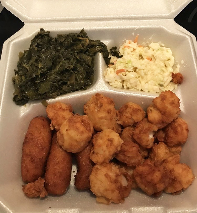 Collard greens, coleslaw, and perfectly fried seafood – the holy trinity of Southern comfort on a takeout plate.