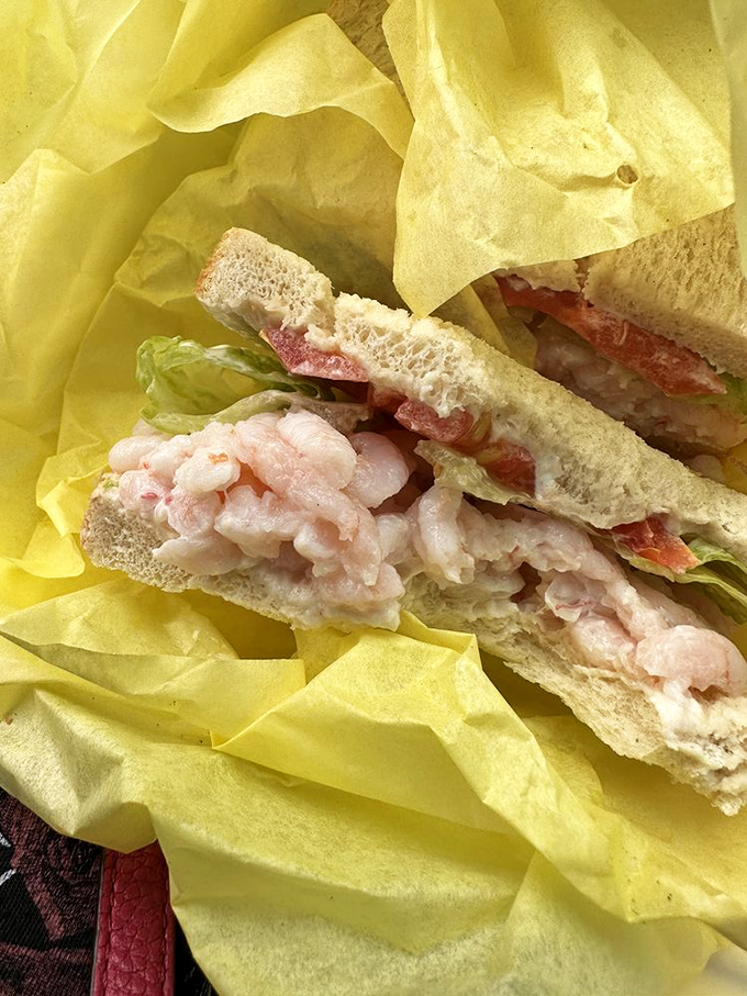 This sandwich doesn't just have shrimp—it celebrates them. Fresh, plump crustaceans nestled in bread like they've found their forever home.