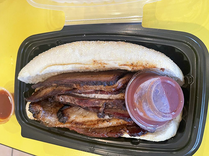 This isn't just a sandwich; it's a masterclass in smoke and patience. That brisket had a long, delicious journey to reach your plate.