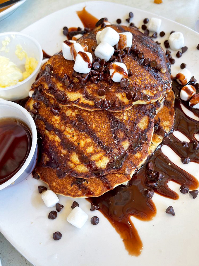 These pancakes don't just look like dessert—they've fully embraced their sweet destiny with marshmallows, chocolate, and caramel in a breakfast disguise.