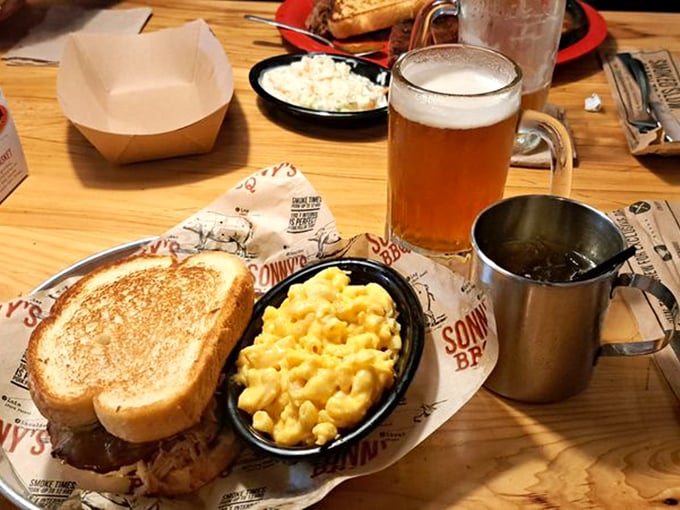 The sandwich that launched a thousand napkins—pulled pork meets melty cheese in a grilled bread embrace that's worth every messy bite.