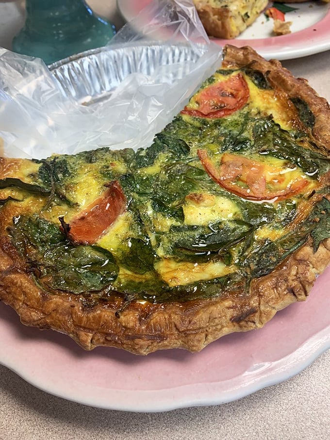 A slice of spinach quiche that puts all other breakfast options to shame. That flaky crust deserves its own fan club.