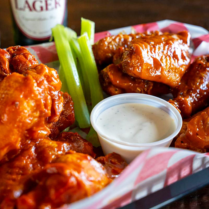 Buffalo wings surrounded by cooling celery stalks—nature's way of providing fire extinguishers right next to the delicious flames.